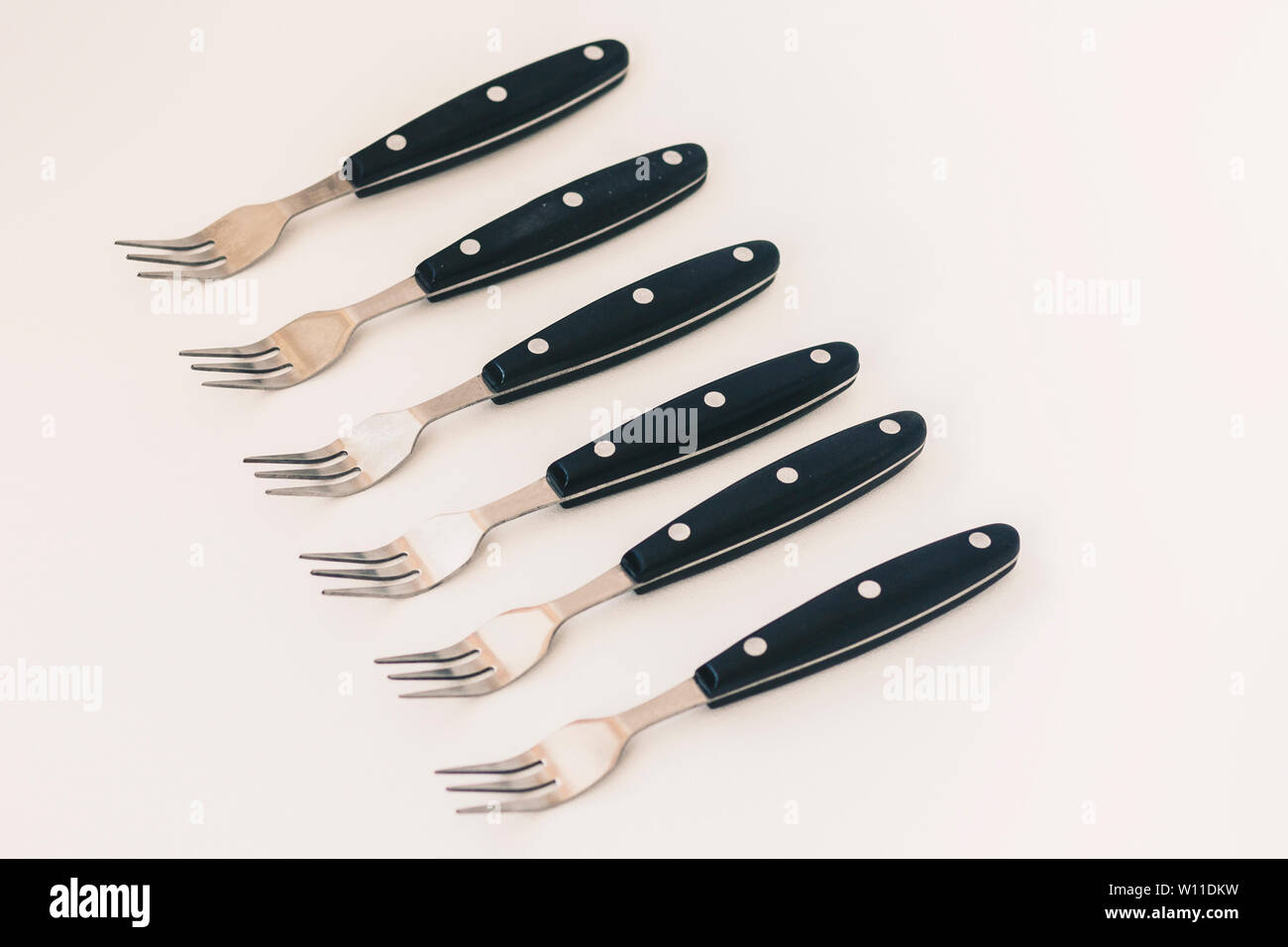 Close up six forks isolated on white background Stock Photo - Alamy