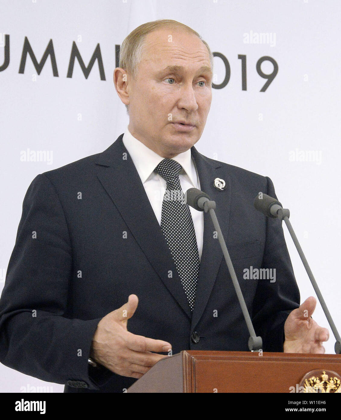Russian President Vladimir Putin meets the press in Osaka on June 29 ...