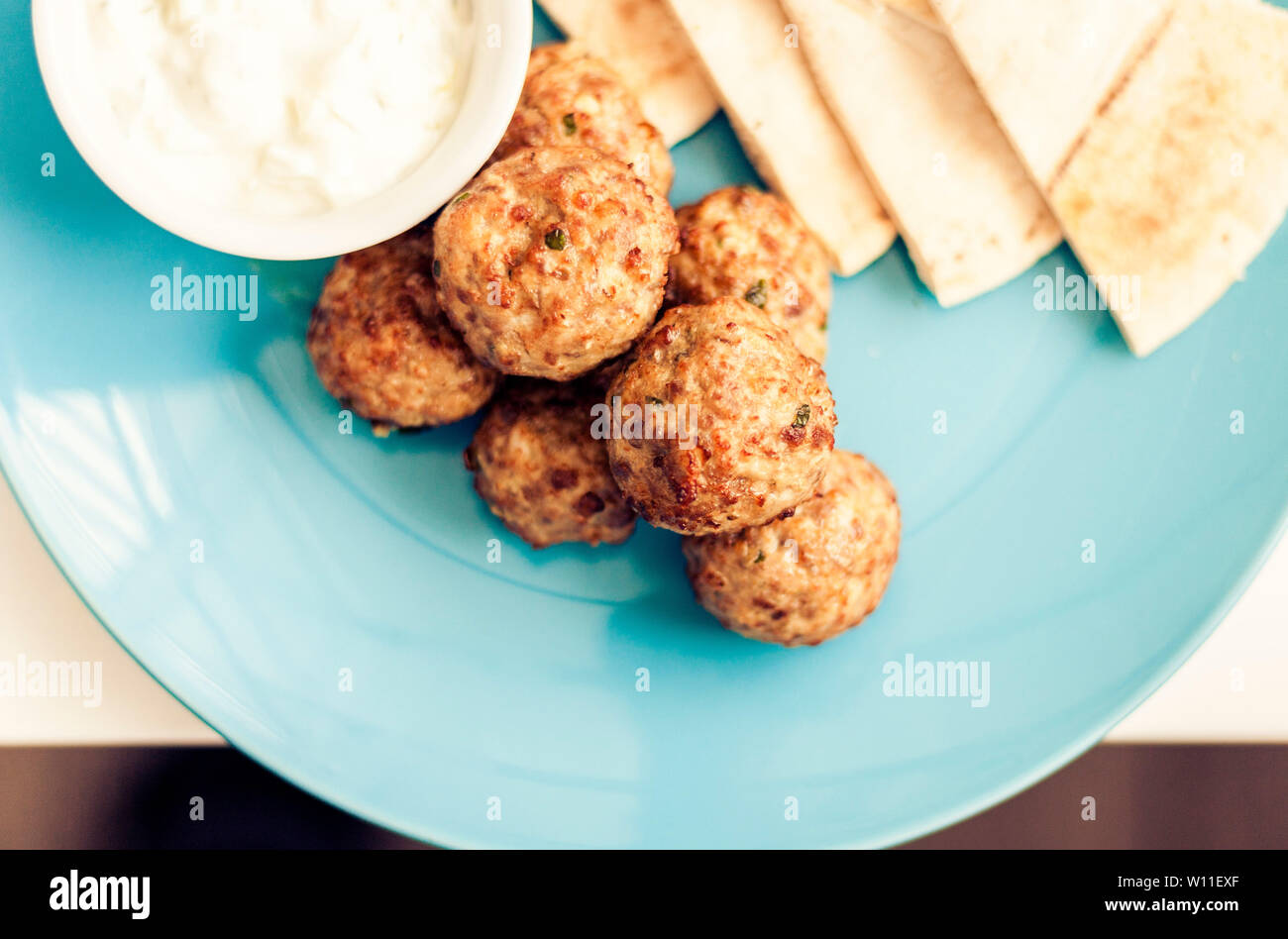 Fried minced meat with sauce and tortillas, traditional Greek lunch on ...