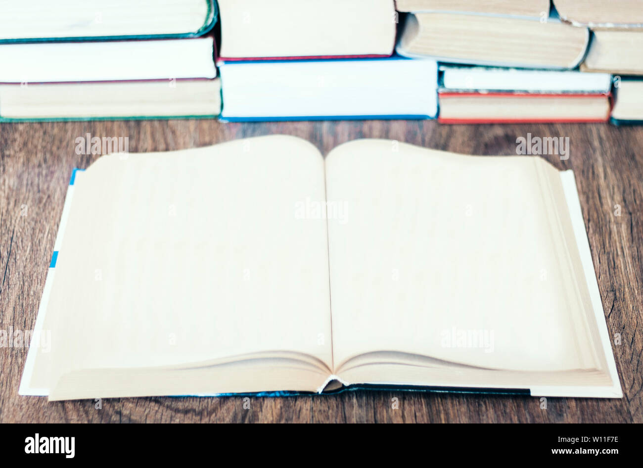Open book with empty page and stack of old book education concept ...