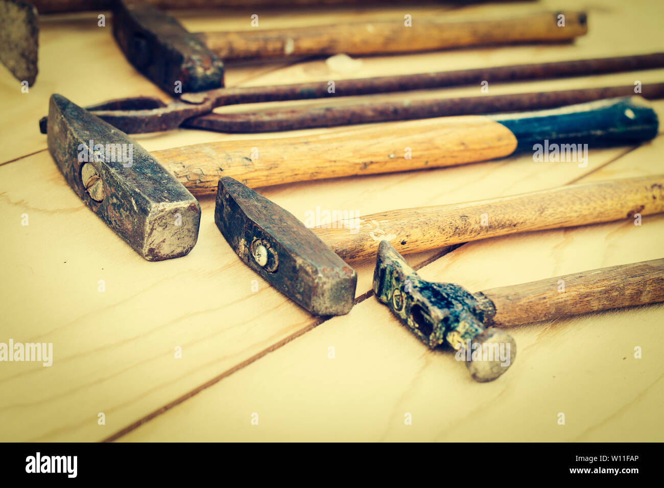 Set of vintage hand construction tools on a wooden background, retro ...