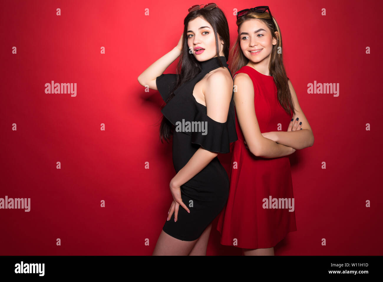 Two woman ready for girls party prom night main theme of weekend wear ...