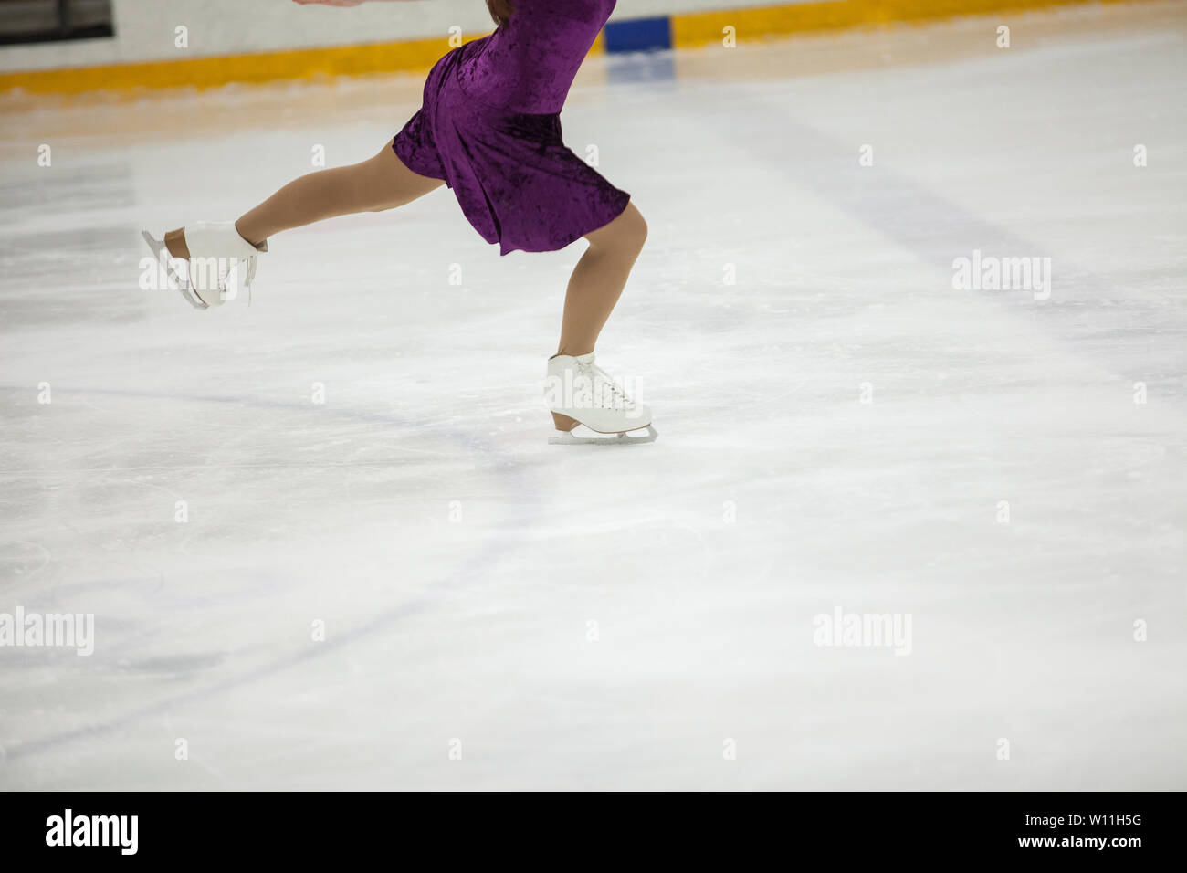 Figure skating, ice skating training. Feet skater on the ice, close-up ...