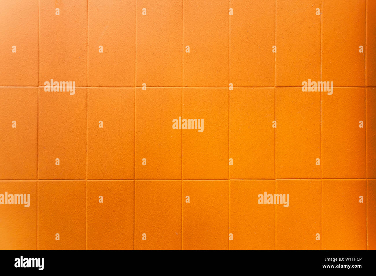 Orange Tiles on a wall Stock Photo - Alamy