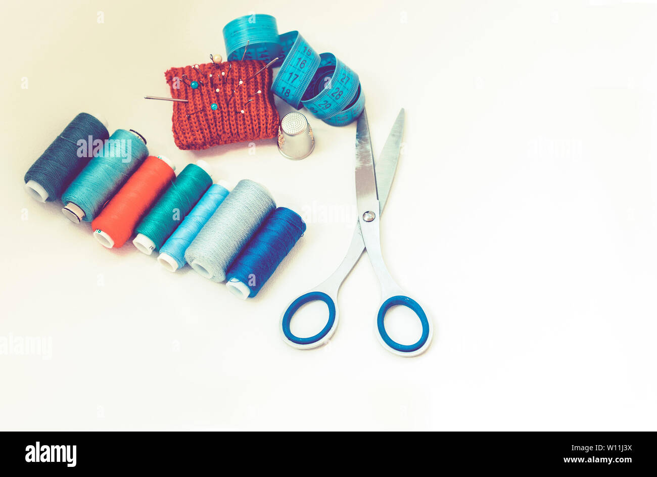 Tools for needlework, red knitted needle pad for sewing, scissors and ...