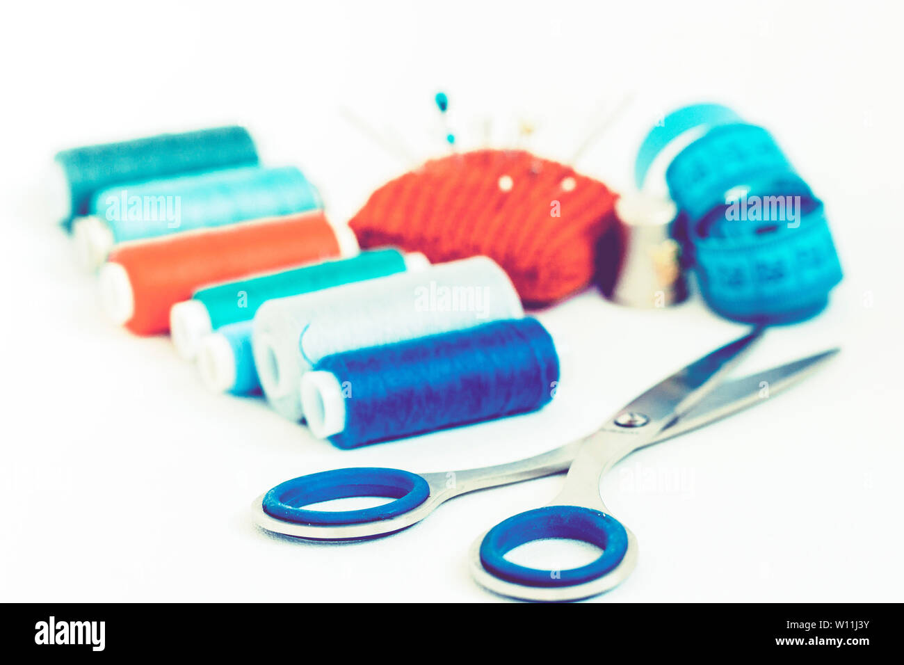 Tools for needlework, red knitted needle pad for sewing, scissors and ...