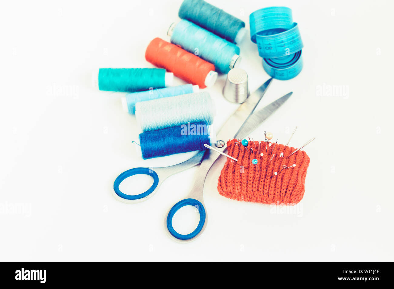 Tools for needlework, red knitted needle pad for sewing, scissors and ...