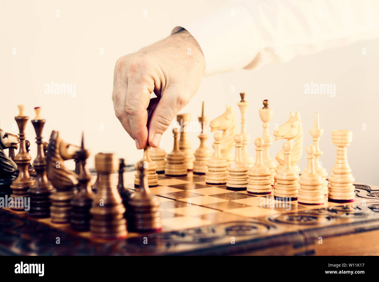 Human hand move chess figure hi-res stock photography and images - Alamy