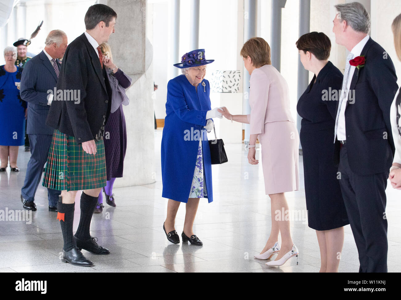 Queen Elizabeth II is greeted by First Minister Nicola Sturgeon as she ...
