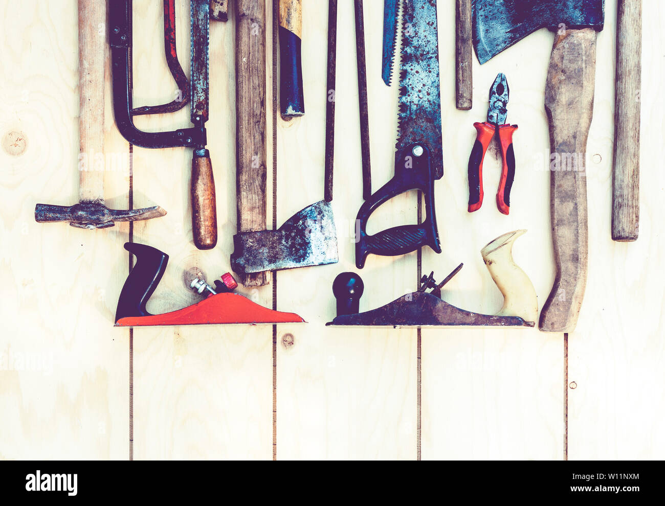 Set of vintage hand construction tools on a wooden background Stock ...