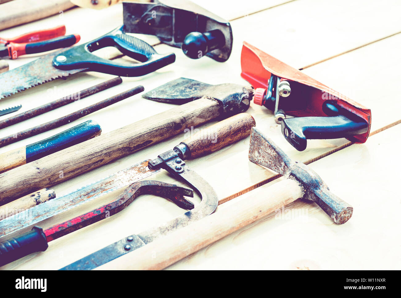 Set of vintage hand construction tools on a wooden background Stock ...