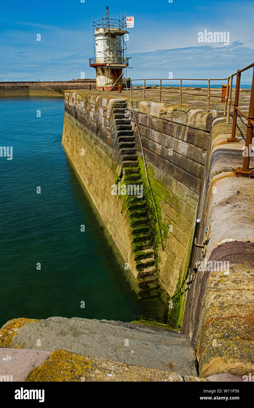 Whitehaven harbour and marina showing scaffold on the lighthouse ready ...
