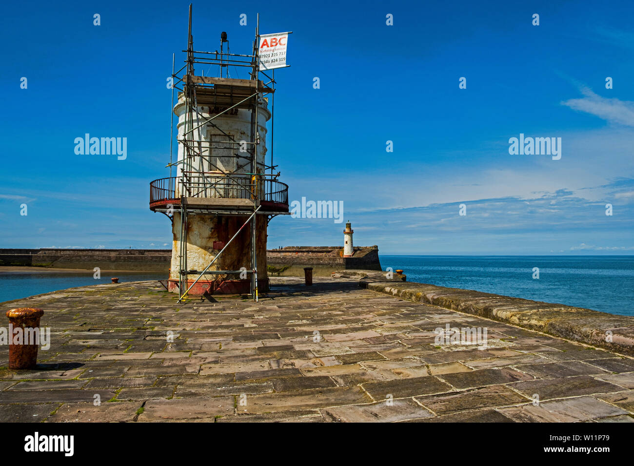Whitehaven harbour and marina showing scaffold on the lighthouse ready ...