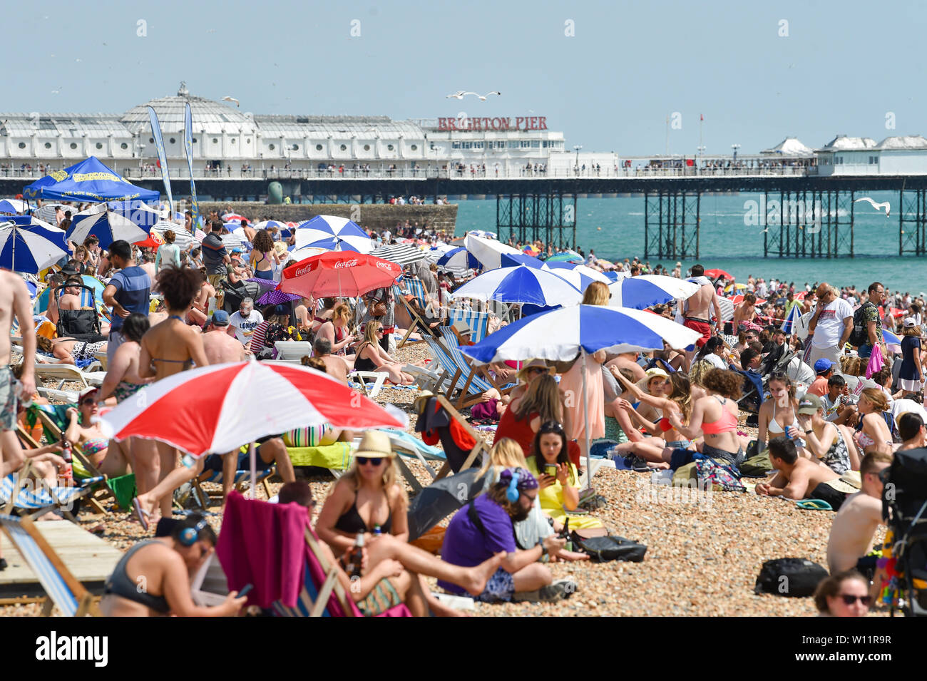 Brighton UK 29th June 2019 - Brighton beach is packed as Britain ...