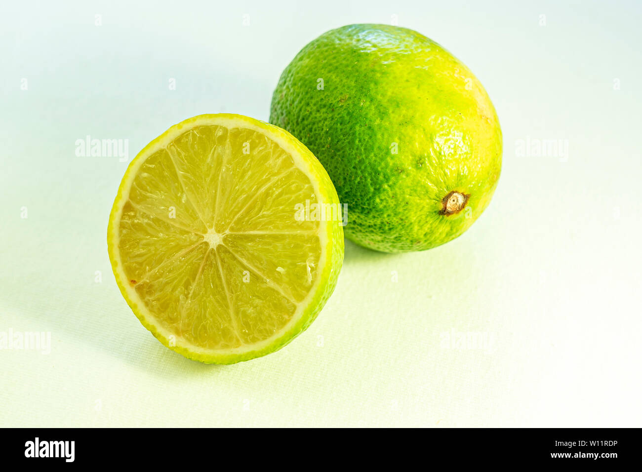 fresh lime fruits cut open, food Stock Photo - Alamy