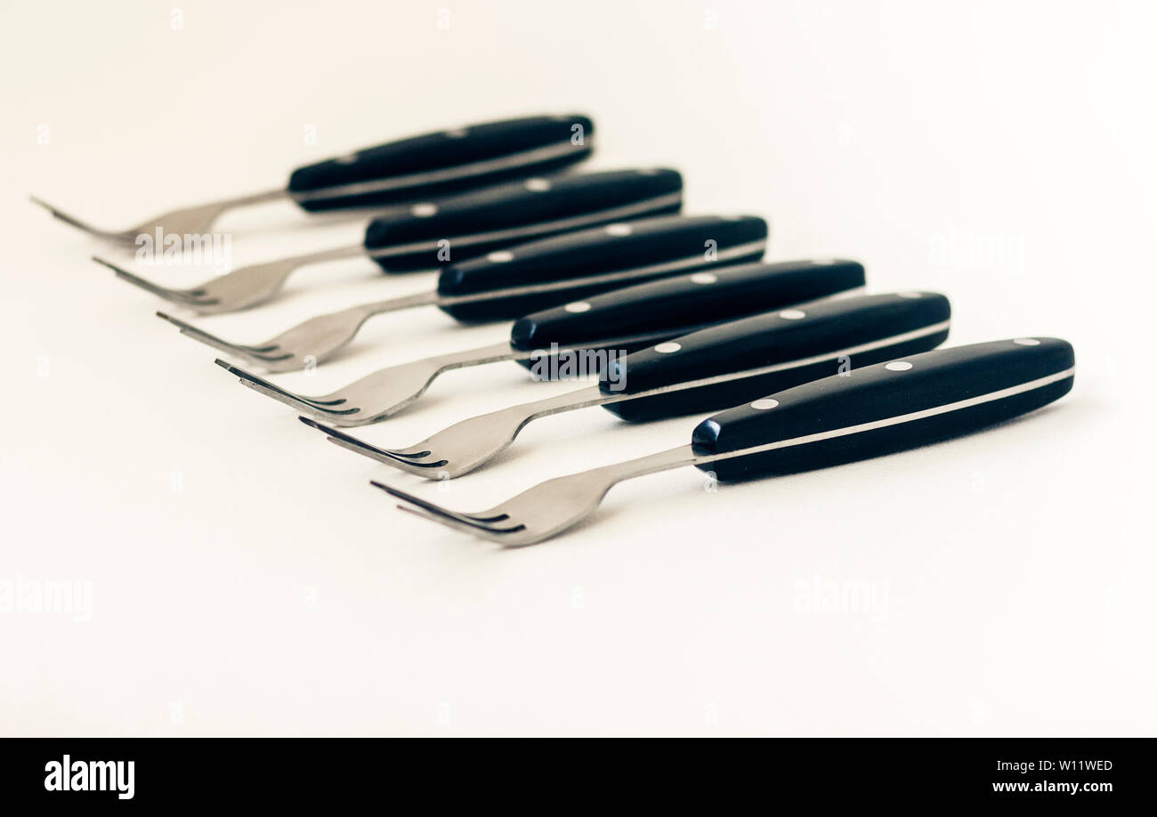 Close up six forks isolated on white background Stock Photo - Alamy