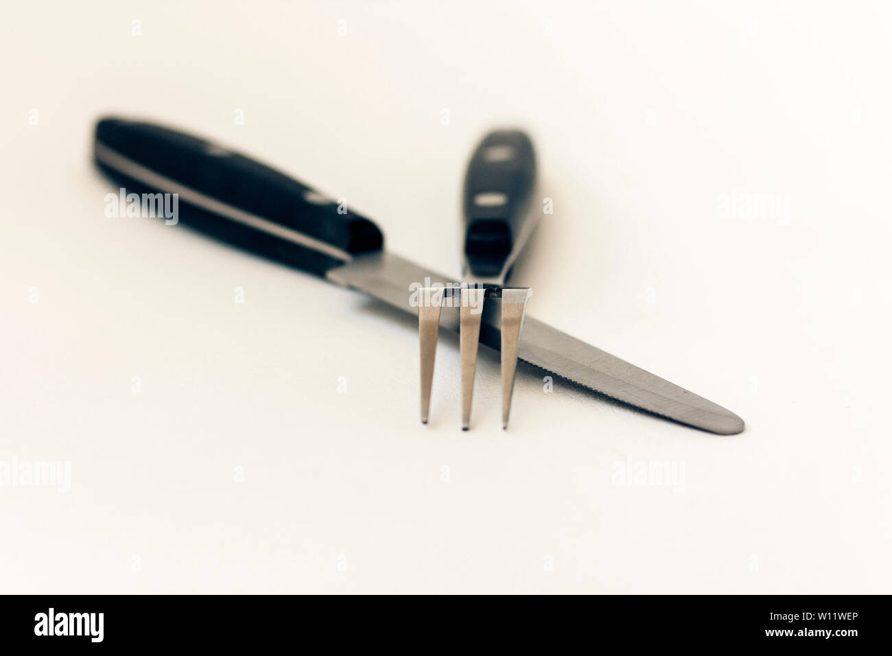 Close up knife and fork crossed, isolated on white background Stock ...