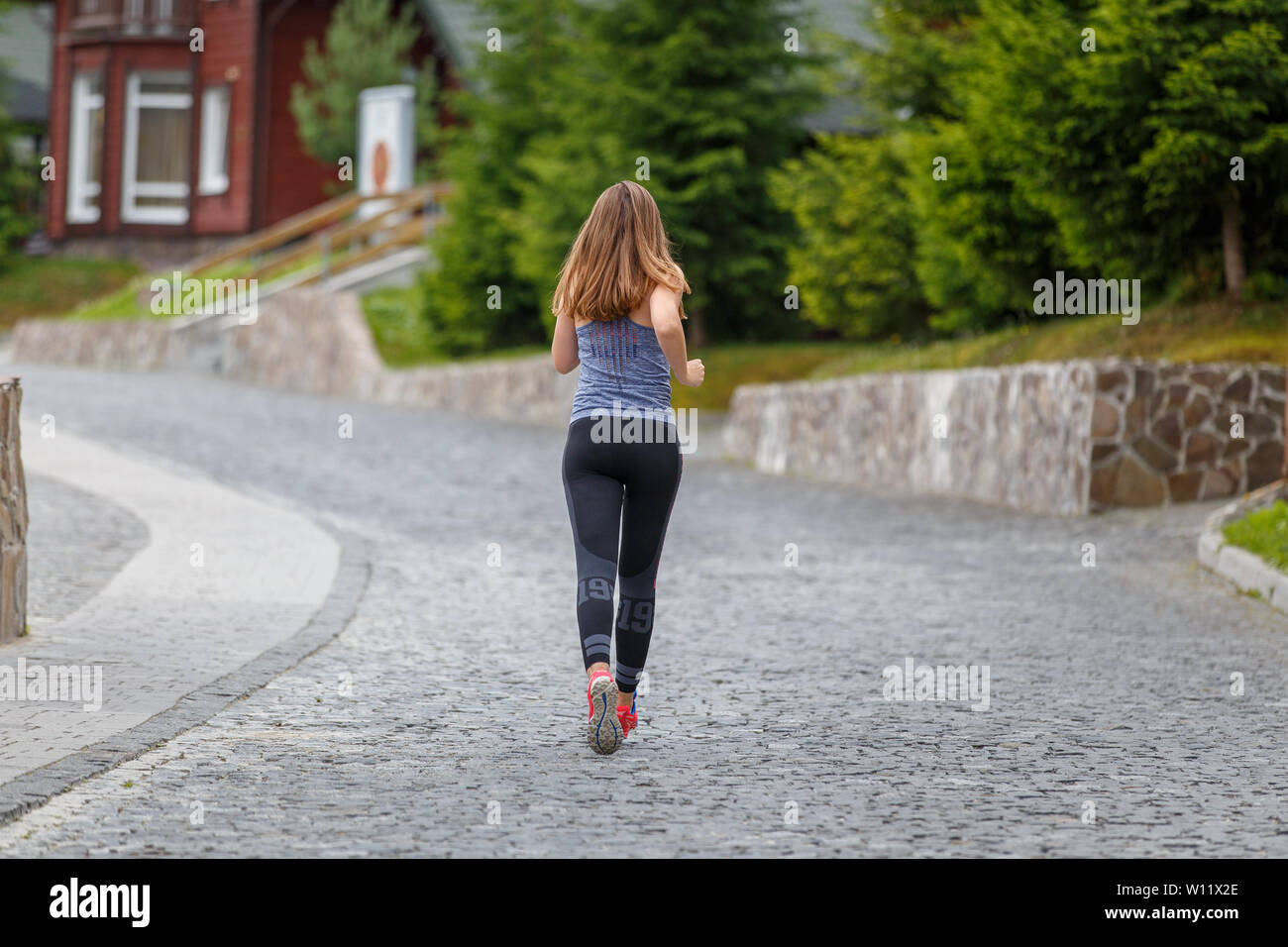 Rear view of female runner hi-res stock photography and images - Alamy