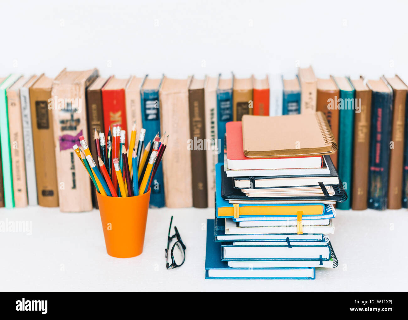 Notebooks piles, stack of books education back to school background ...