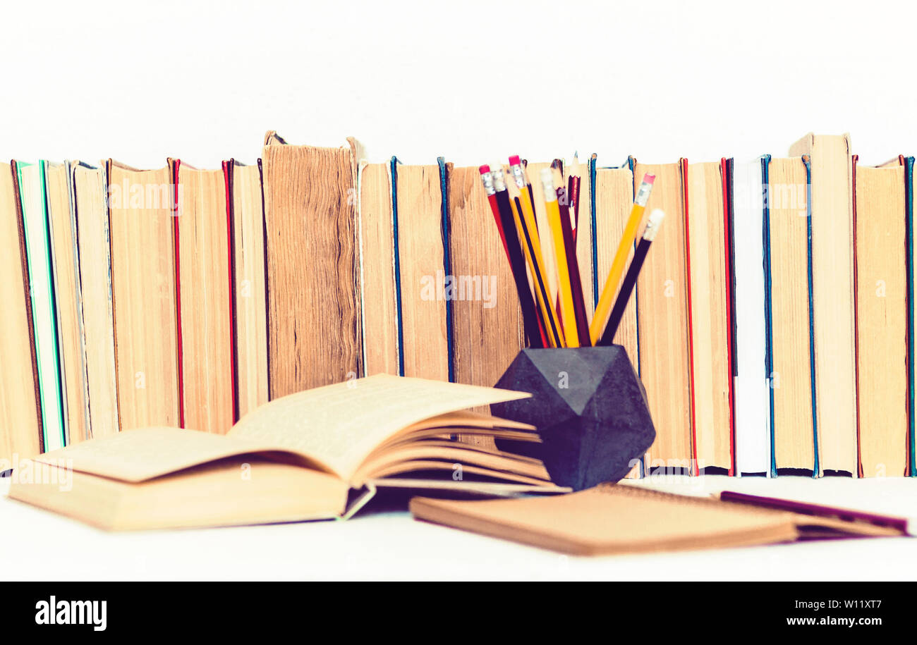 Open textbook, notebook, stack of books education back to school ...