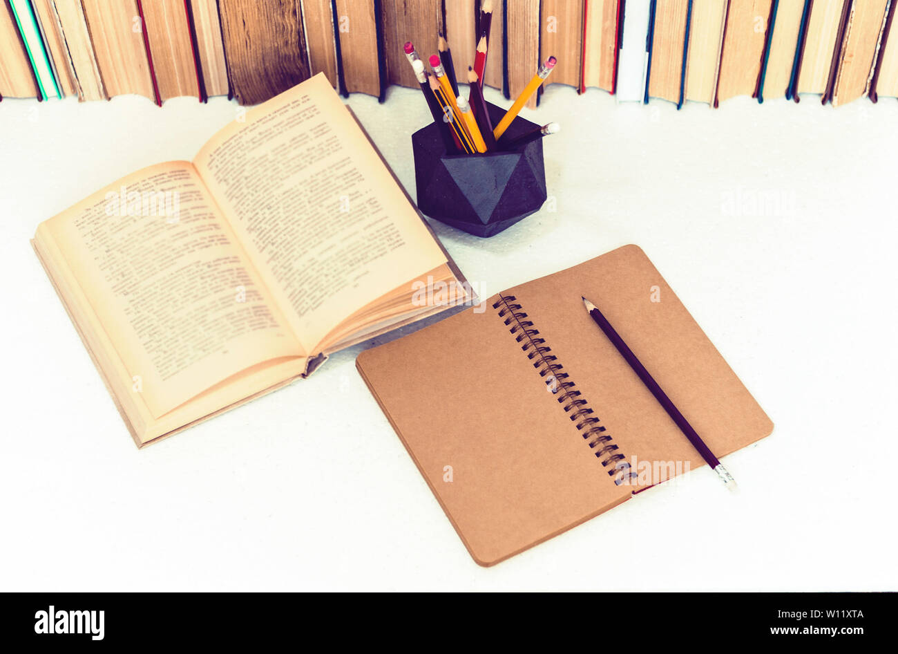 Open textbook, notebook, stack of books education back to school ...