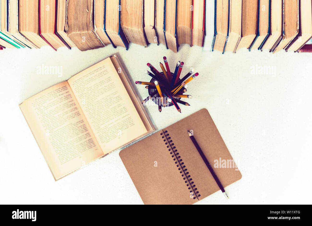 Open textbook, notebook, stack of books education back to school ...