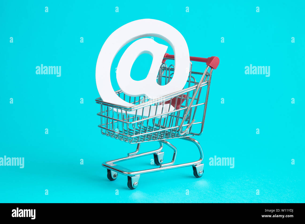 Email sign in shopping cart against blue background. Online shop ...