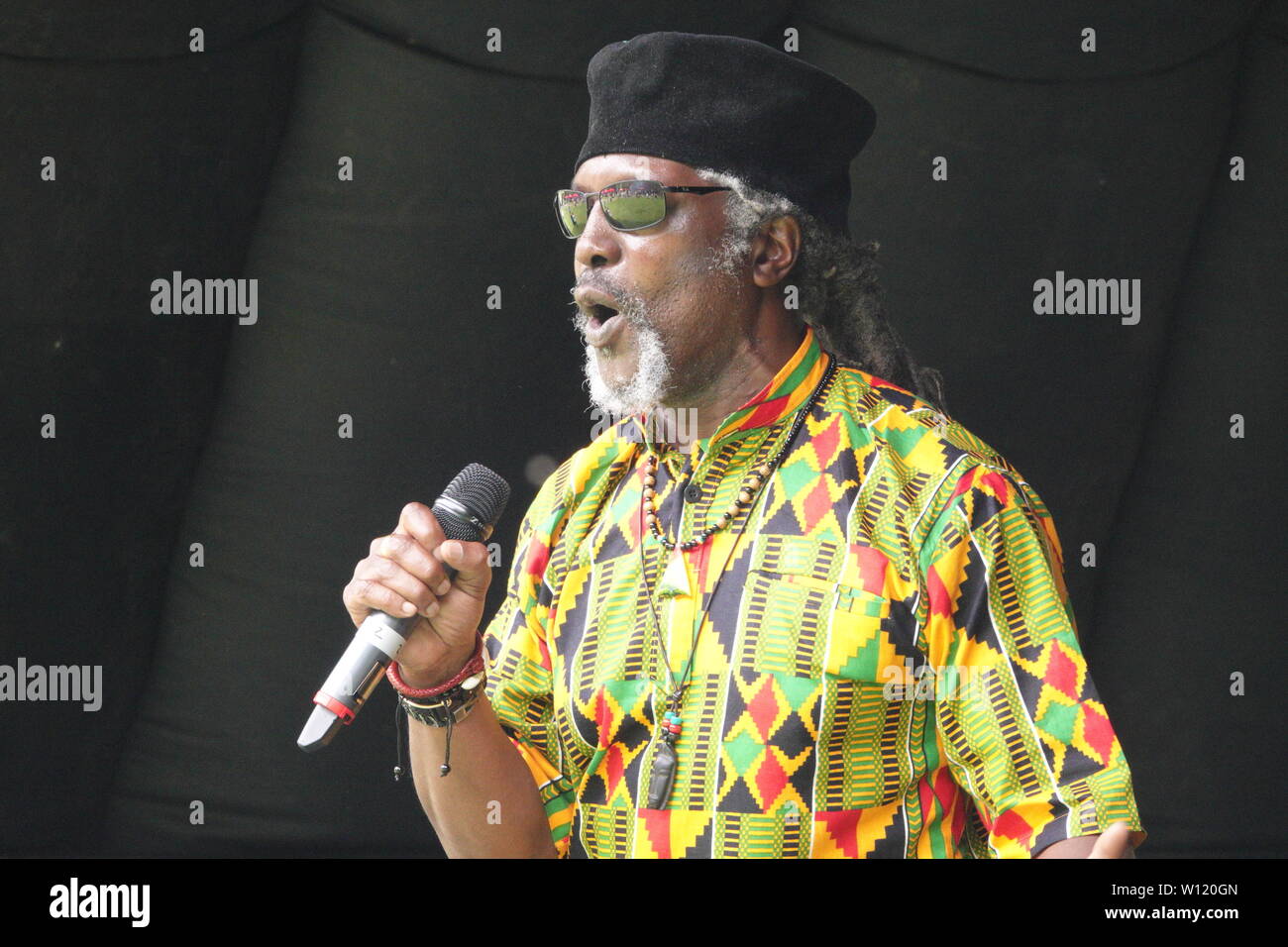 Liverpool, UK. 29th June, 2019. Local poet Levi Tafari on stage at ...