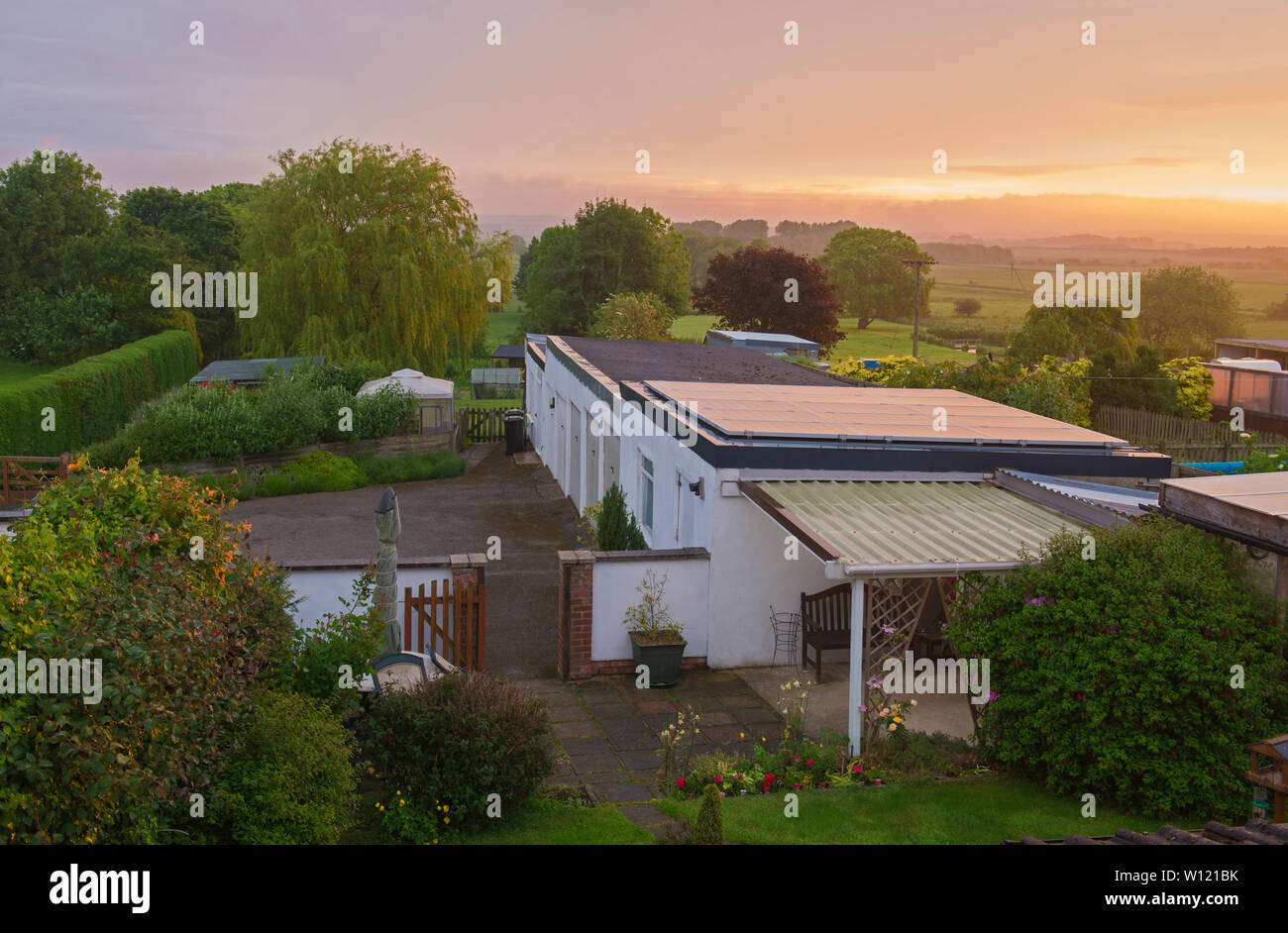 Landscape view of early morning sunrise dawn over rural english ...