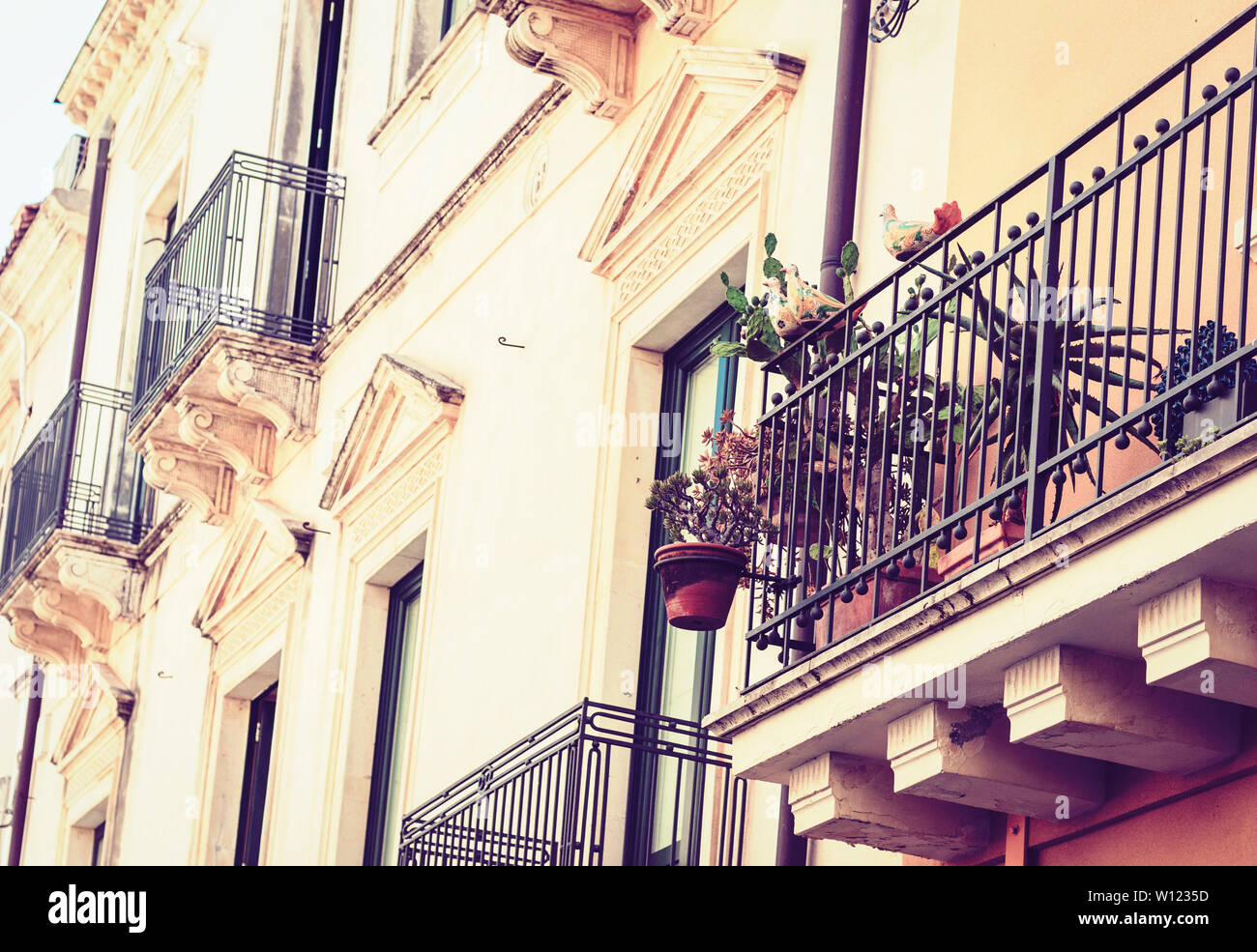 balcony in old baroque building in Taormina, traditional architecture ...