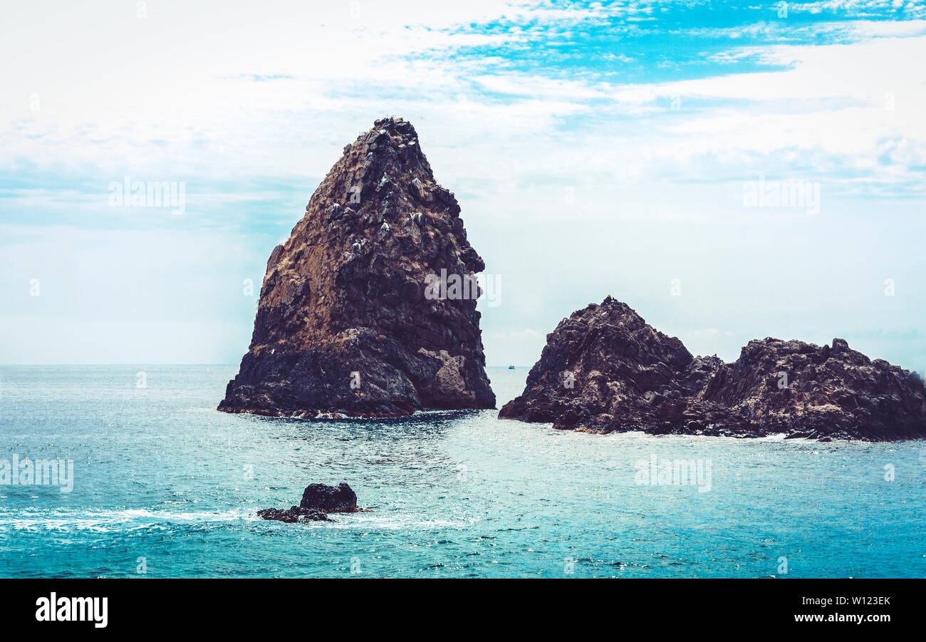 Acitrezza rocks of the Cyclops, sea stack in Catania, Sicily Stock ...