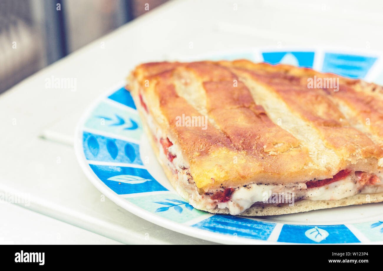 Fried calzone pizza with ham, mozzarella, tomatoes from bakery shop of ...