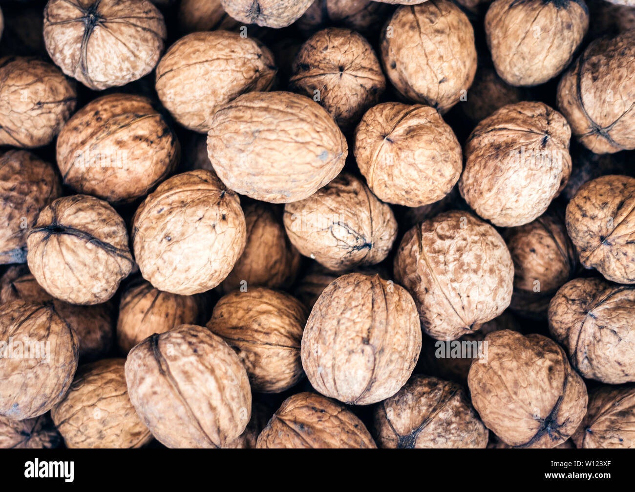Natural walnut in shell background pattern texture Stock Photo - Alamy