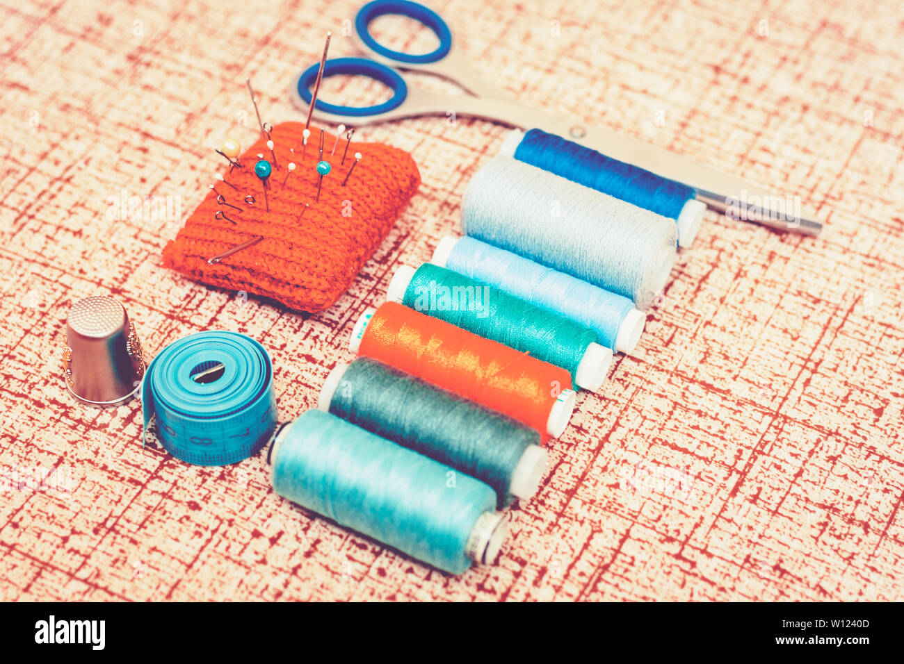 Tools for needlework, red knitted needle pad for sewing, scissors and ...