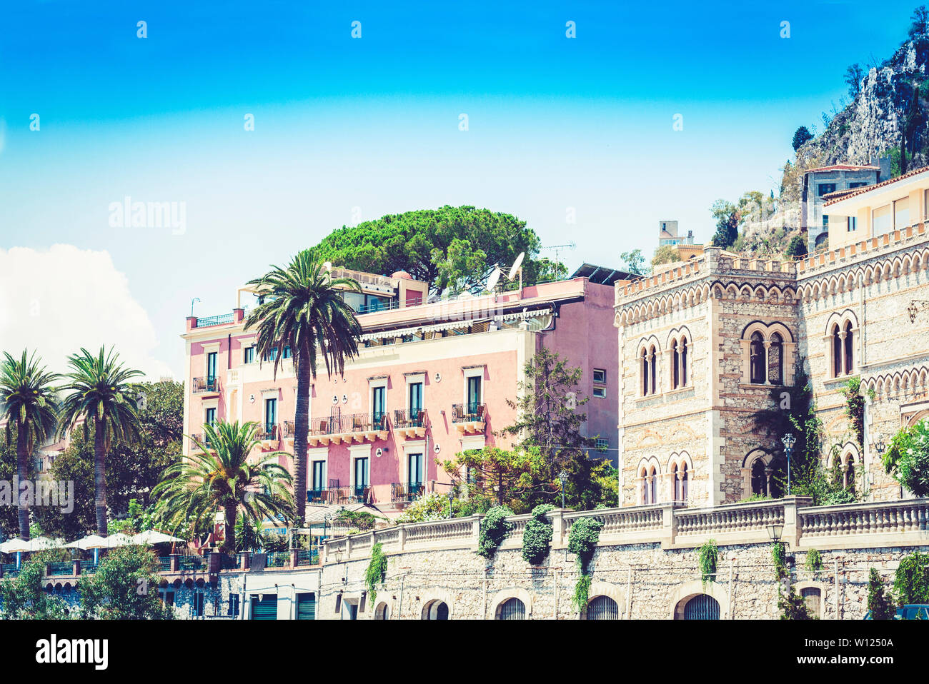 Facade of old baroque buildings in Taormina, traditional architecture ...