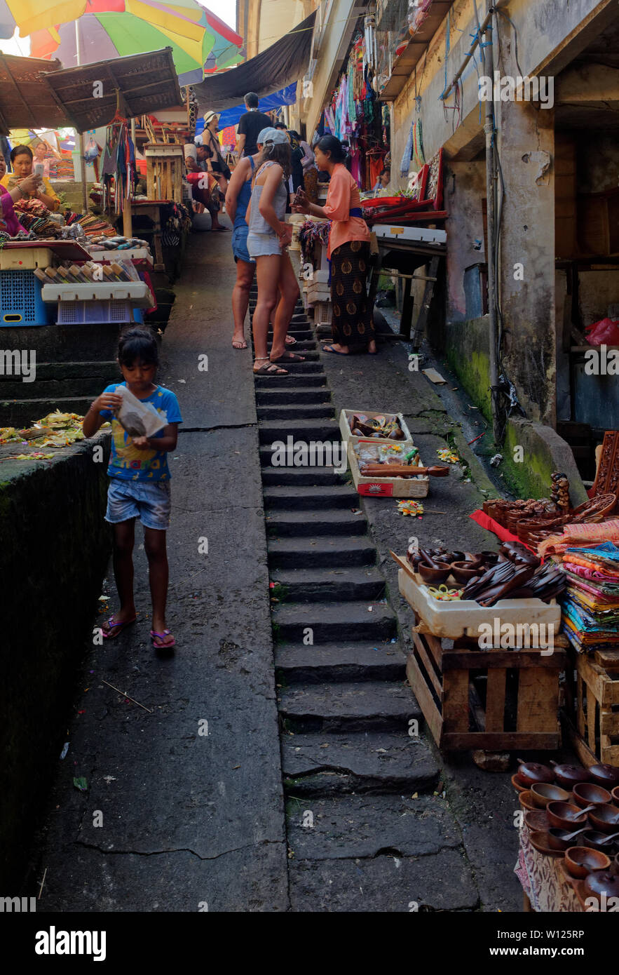 Tourists shopping in Ubud old craft market, Bali, Indonesia Stock Photo ...