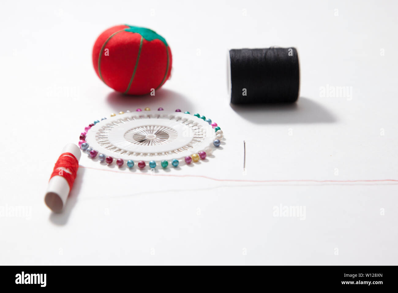 Sewing equipment with pin cushion and needle and thread Stock Photo - Alamy