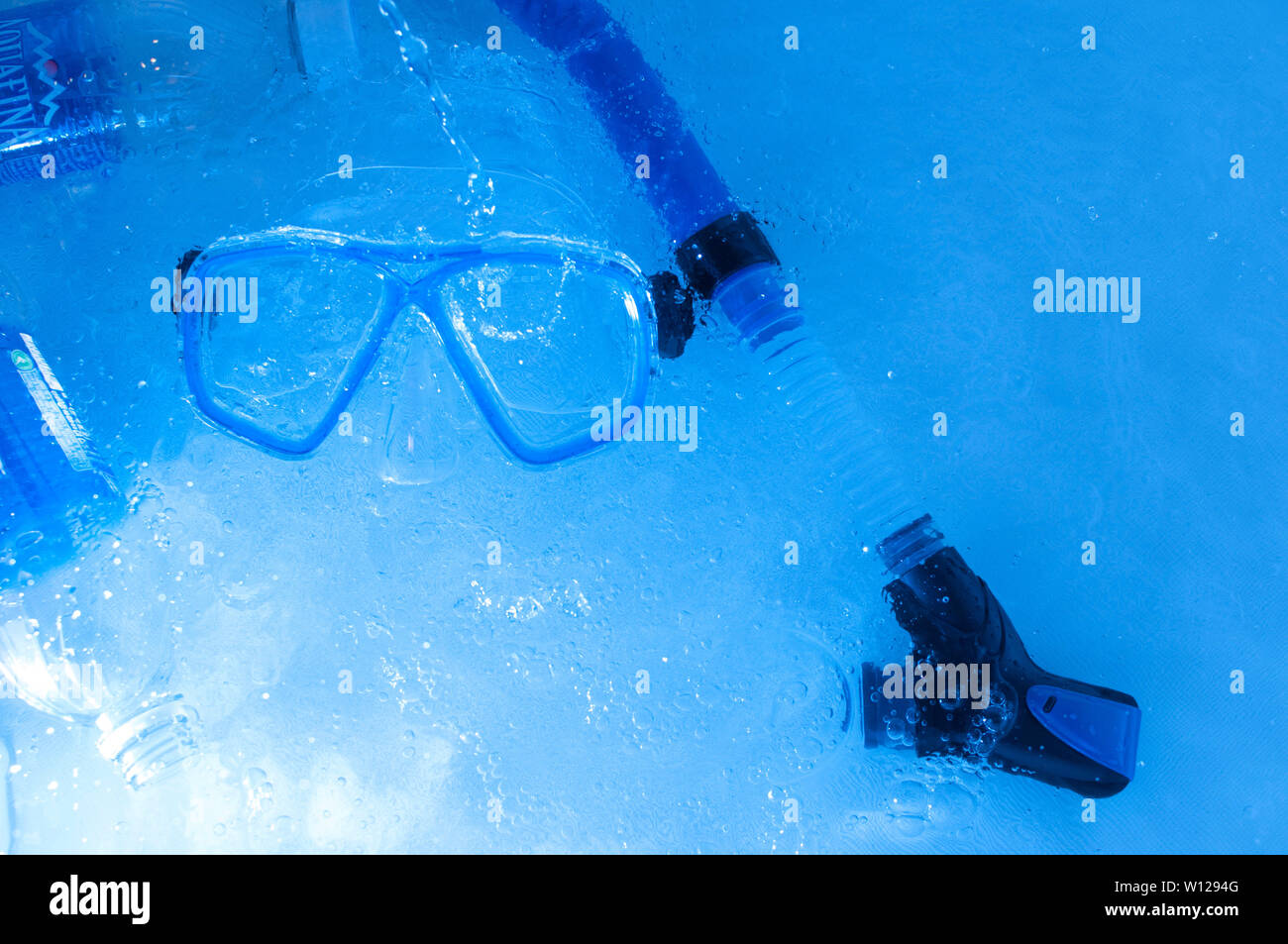 Snorkel and mask underwater with water bottles Stock Photo - Alamy