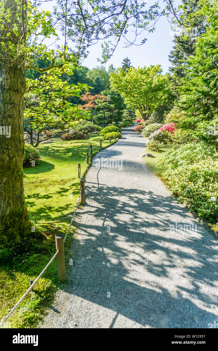 A view of a walkway in a garden in Seattle, Washington. It is ...