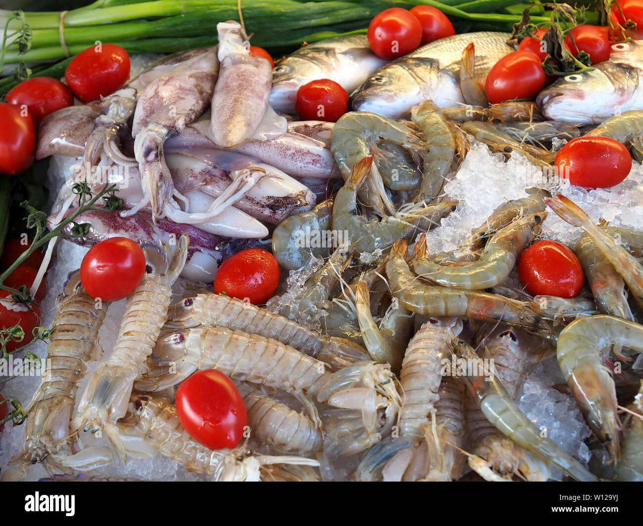Fresh gourmet seafood at a restaurant with shrimps, fishes, octopus and ...