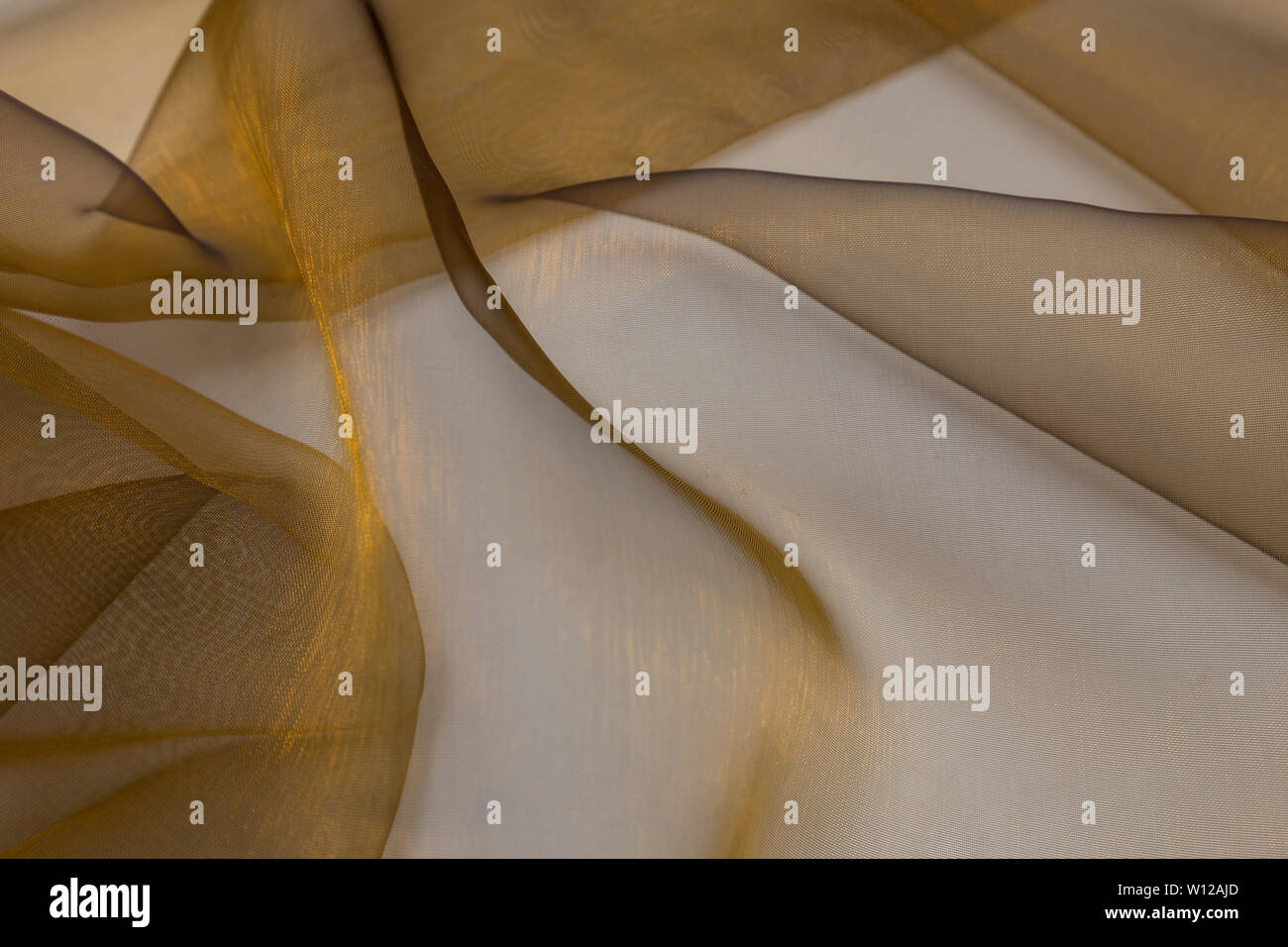 Beautiful close up of yellow silk fabric with textile texture ...