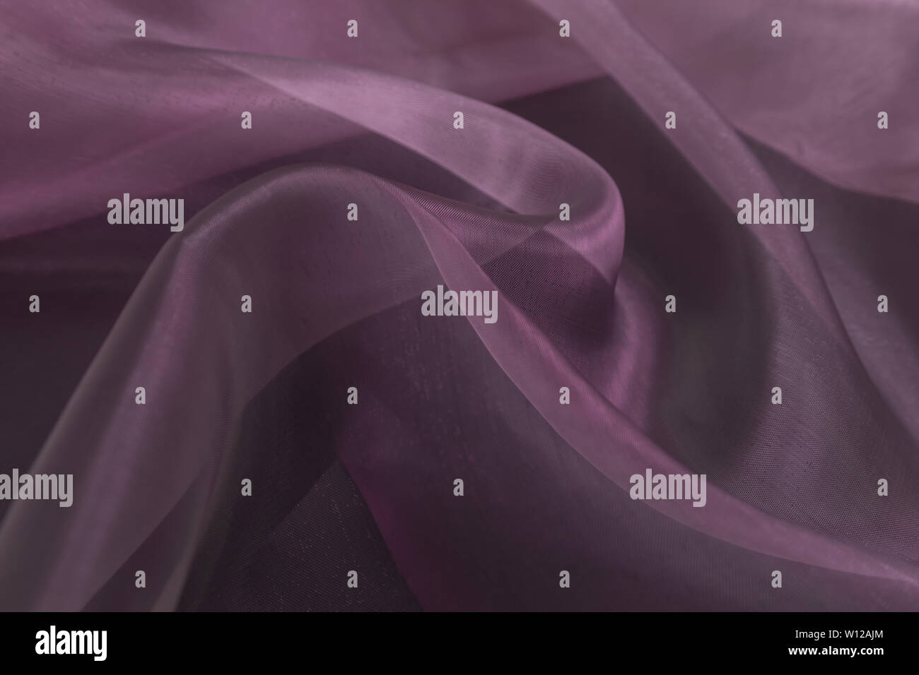 Beautiful close up of violet silk fabric with textile texture ...