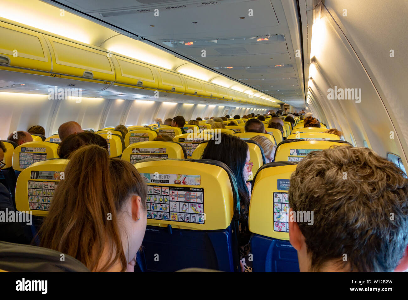 Passengers inside the cabin of a Ryanair Boeing 737 Jet plane Stock ...