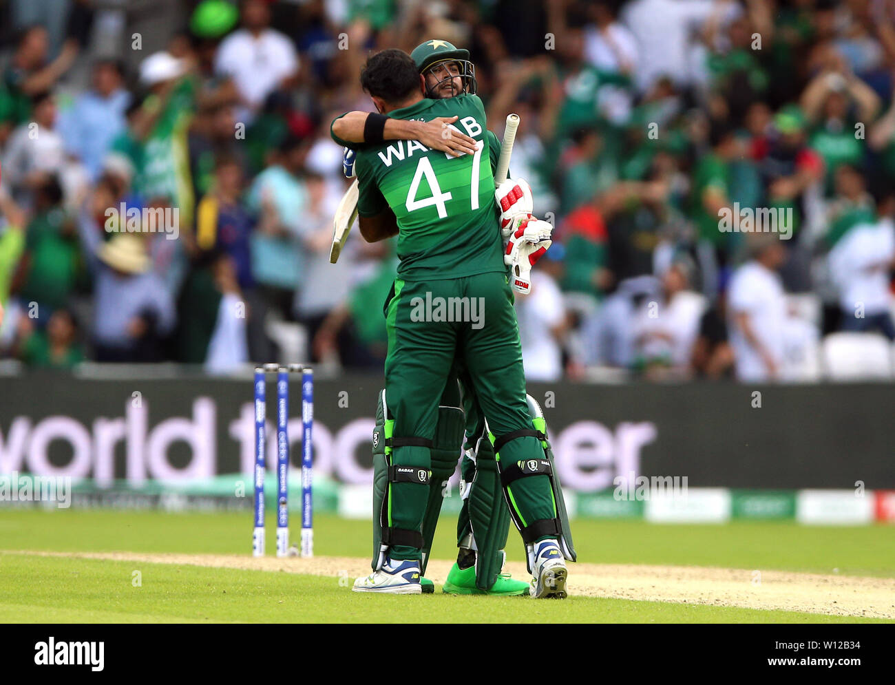 Pakistan's Imad Wasim (left) and Wahab Riaz celebrate winning the ICC ...
