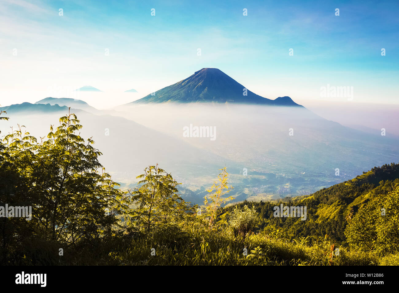 Sunrise with Sindoro mountain view from Pakuwojo Hill, Dieng, Wonosobo ...