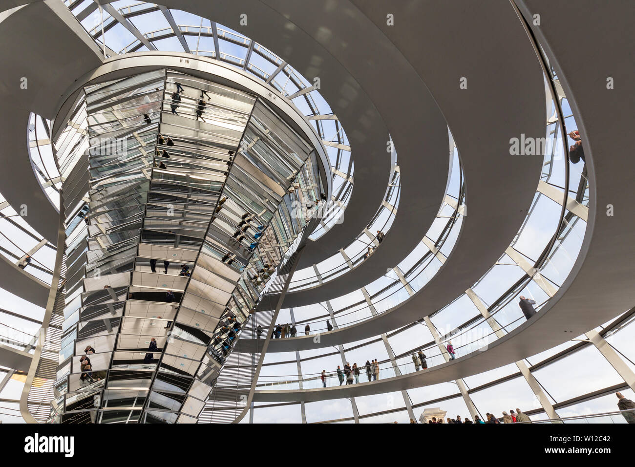 Mirrored cone and tourists inside the futuristic glass dome on top of ...