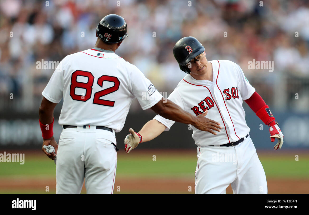 Boston Red Sox' Brock Holt and Tom Goodwin celebrate during the MLB ...