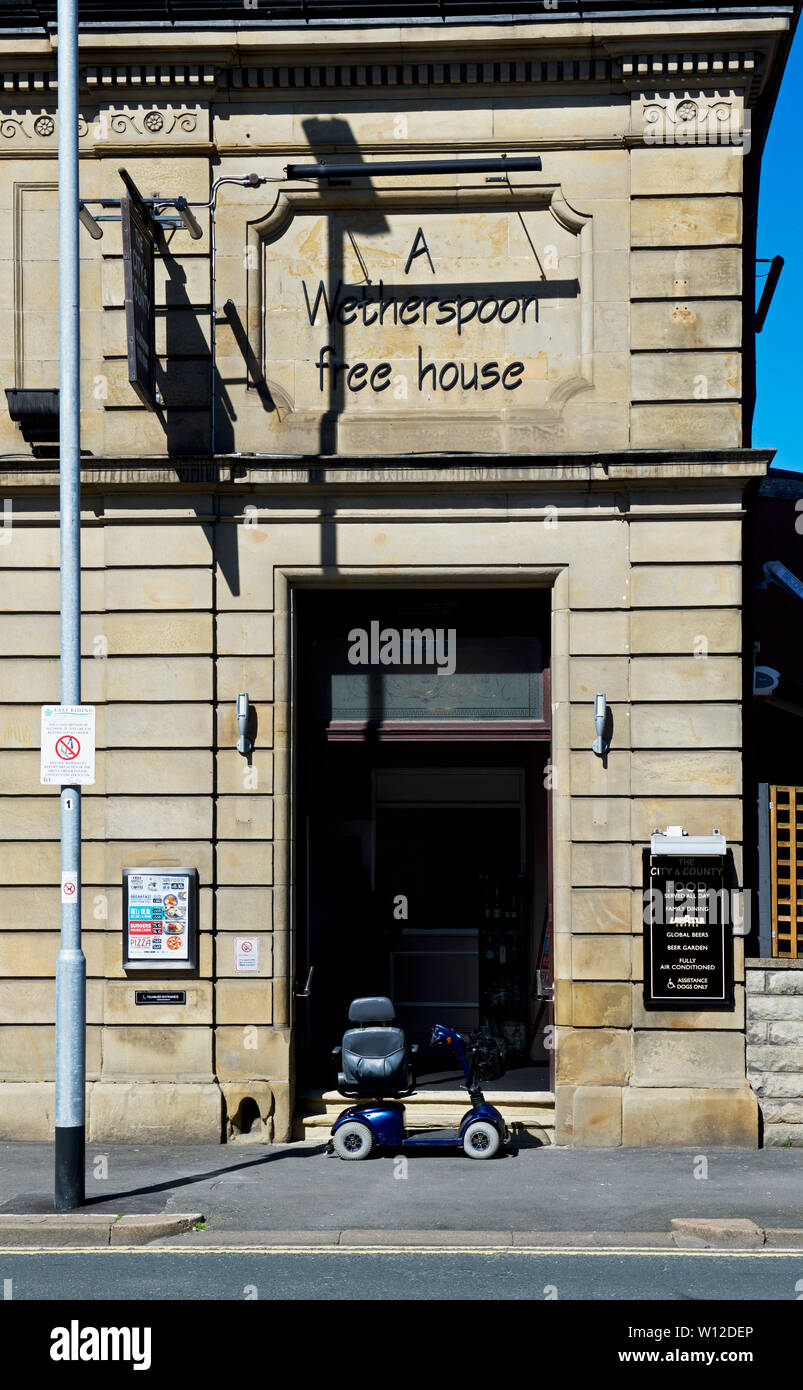 Mobility scooter outside the City & County, a Wetherspoon pub in Goole ...