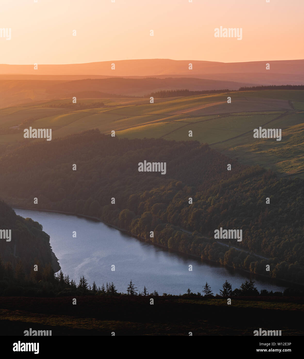 A beautiful aerial view of an epic sunset over Win Hill in the Peak ...