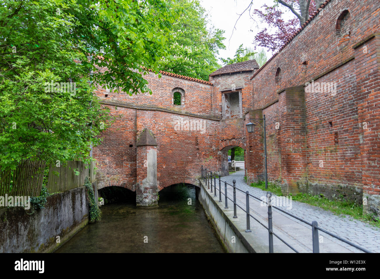 Channnel with wild fish (trout) swimming in it flowing trough the walls ...